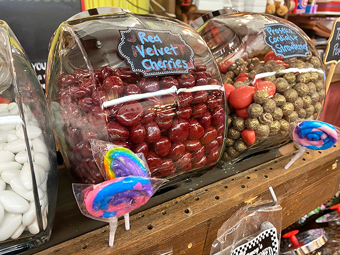 Red Velvet Cherries glisten in their display jar – plump, juicy cherries wearing luxurious chocolate coats.