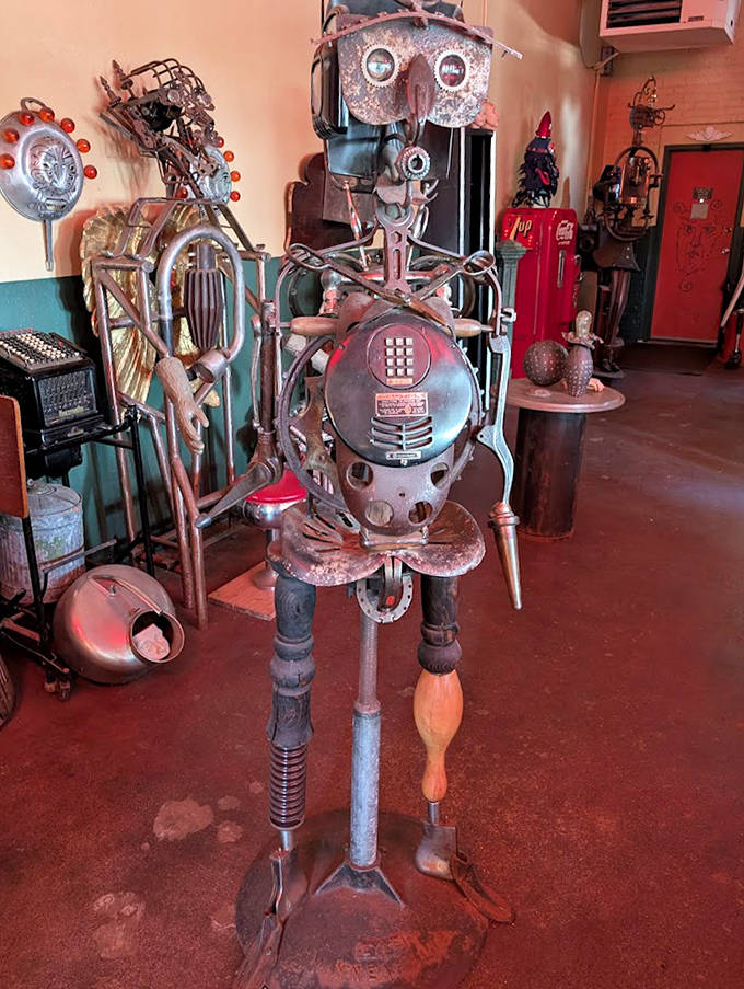 This metallic figure, assembled from vintage telephone parts and kitchen utensils, stands ready to take your call from the artistic beyond.