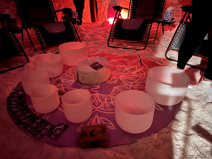 Sound healing meets salt therapy in this cosmic relaxation room, where chakra-colored bedding suggests you're about to journey beyond Ohio.