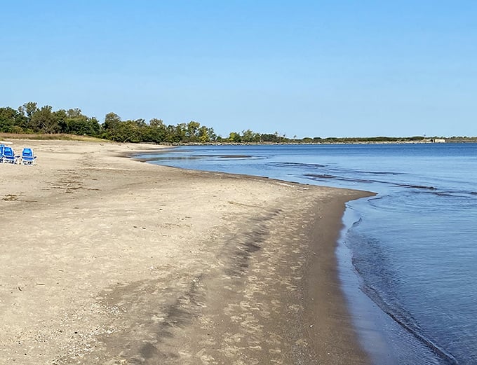 Morning tranquility at Nickel Plate Beach, where the calm waters mirror the sky in a display of natural symmetry.