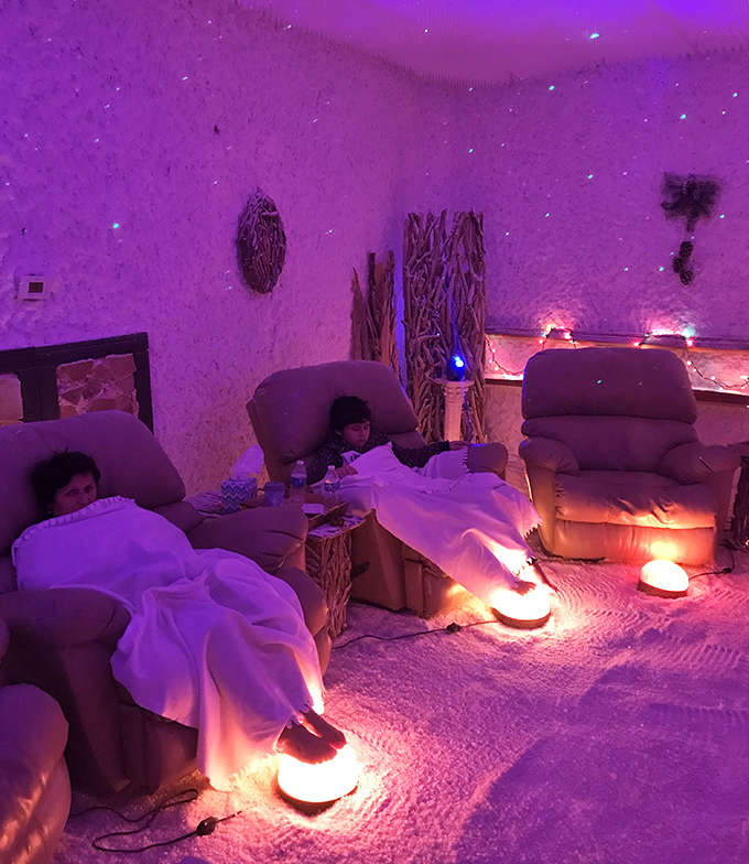 Guests sink into comfortable recliners while breathing in therapeutic salt particles, proving that doing absolutely nothing can be incredibly productive.
