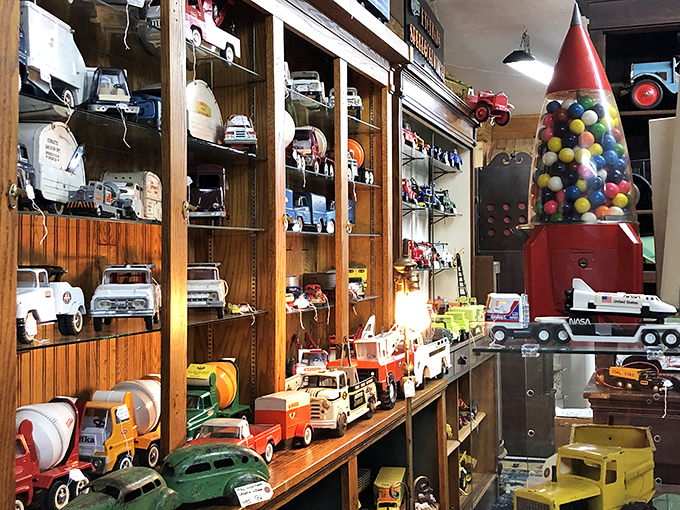 Toy trucks that have outlived their original owners line these shelves, reminding us when playthings were built to last generations, not just seasons.