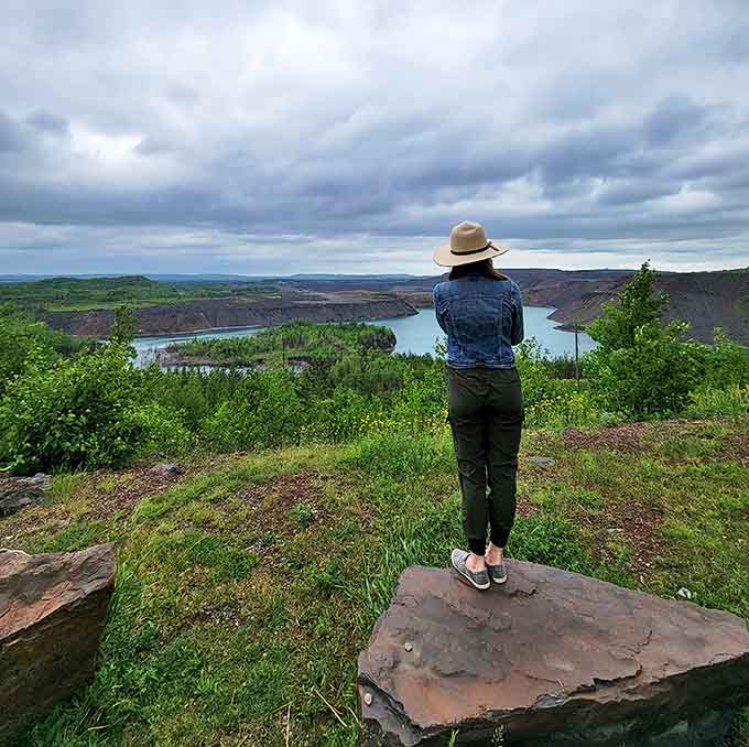 Contemplating infinity at the edge of Minnesota's grand canyon, where the Iron Range unfolds like a geological storybook.