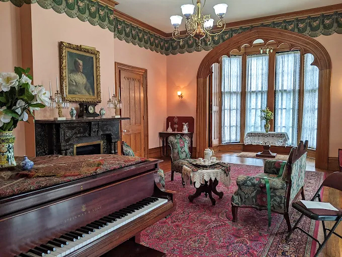 The parlor where 19th-century social networking happened face-to-face. That piano has heard more gossip than any Facebook wall ever will.