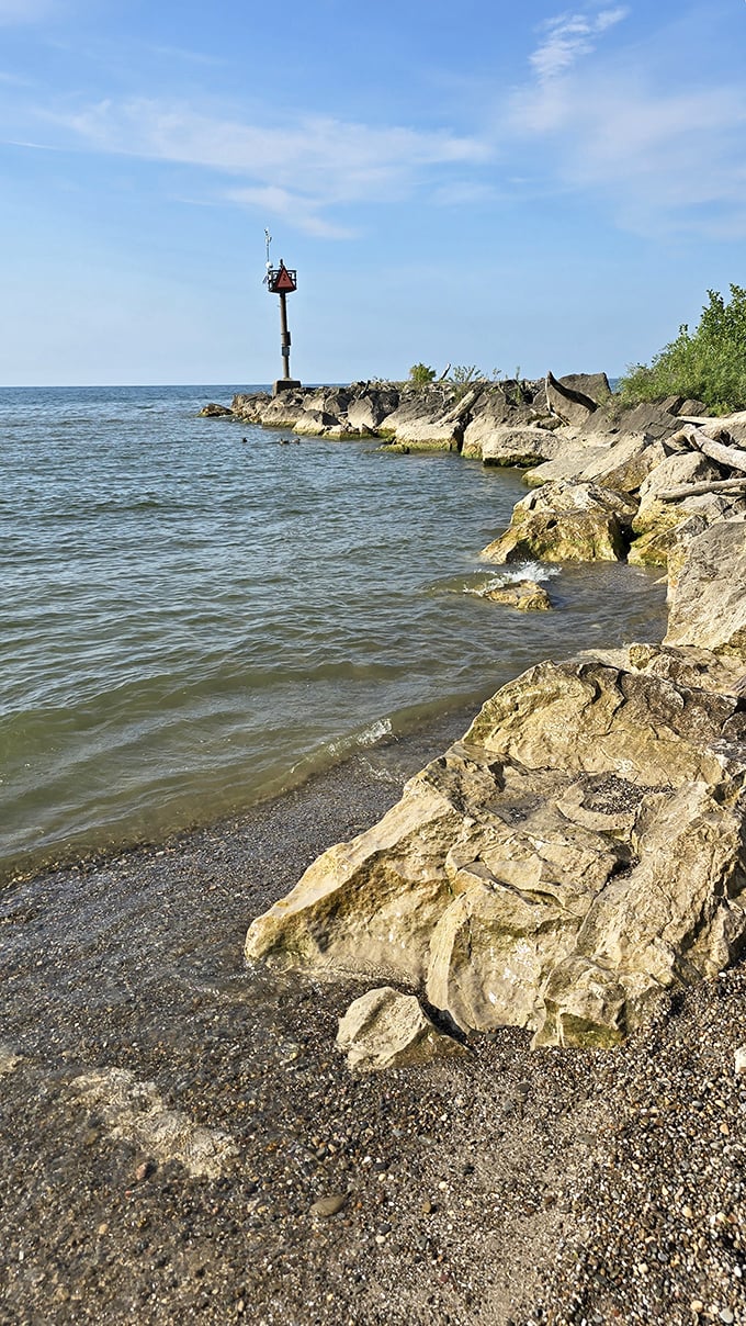 The rocky breakwater creates a natural barrier, protecting swimmers while providing an excellent perch for contemplative lake-gazing or amateur fishing.