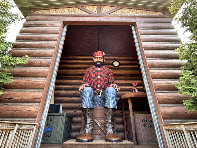 Paul Bunyan sits tall inside his cabin home, his checkered shirt and sturdy boots ready to welcome wide-eyed visitors to his larger-than-life world.