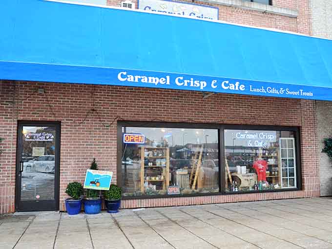 The vibrant blue awning stands out like a beacon for anyone seeking exceptional baked goods and gourmet snacks in downtown Oshkosh.