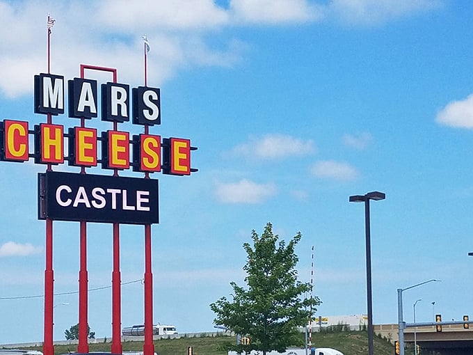 The iconic Mars Cheese Castle sign towers above the highway, a beacon for cheese lovers and hungry travelers alike. Wisconsin's dairy kingdom awaits!