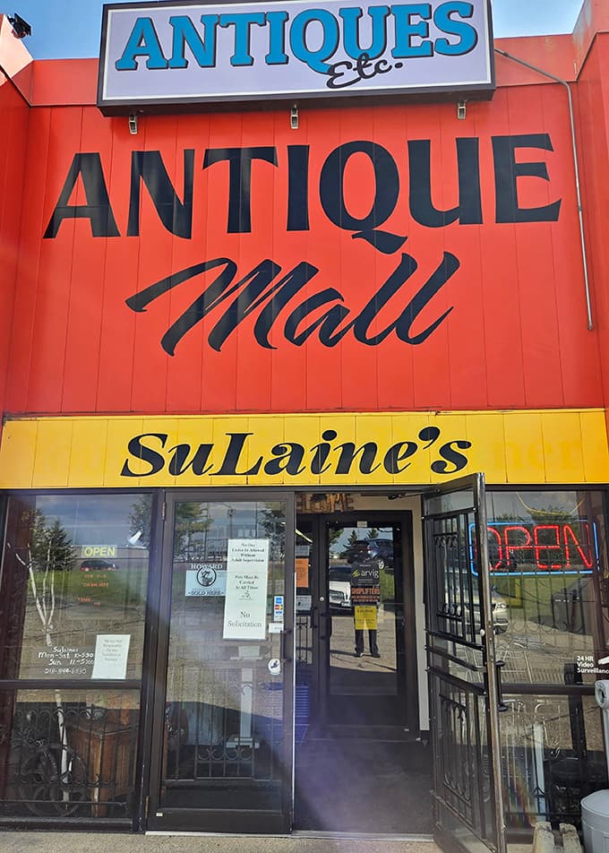 The bold red and yellow exterior of Sulaine's Antique Mall stands out like a beacon for collectors seeking one-of-a-kind treasures.