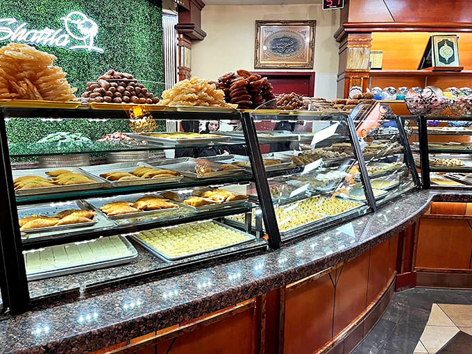 The dazzling display cases at Shatila showcase jewel-like pastries, with rows of baklava, mamoul, and other treats that look almost too beautiful to eat.