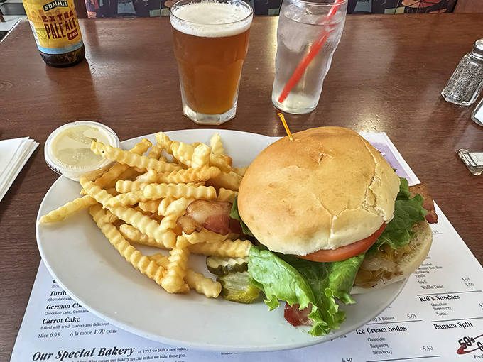 The classic cheeseburger arrives with crinkle-cut fries &ndash; no foodie pretension here, just honest-to-goodness American comfort on a plate.