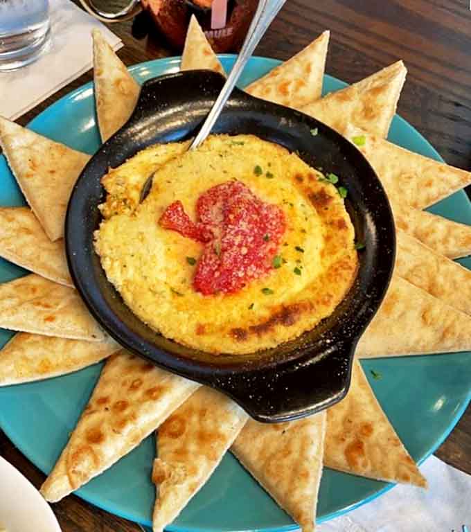 A volcanic eruption of cheese and seafood surrounded by pita triangles &ndash; the dish that launches a thousand "What's THAT?" questions.