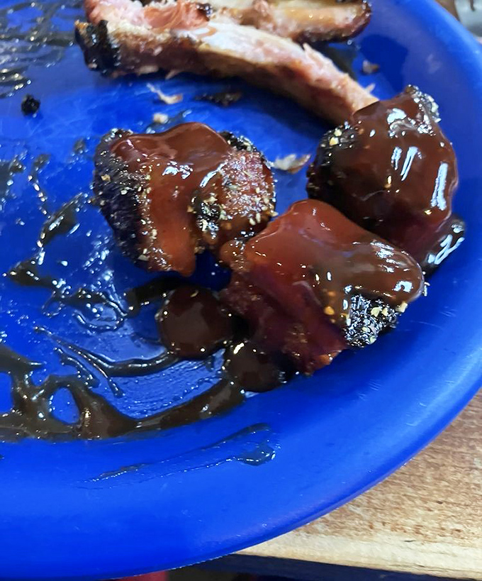 Glistening pork belly chunks bathed in sweet-savory sauce create the kind of food moment that makes conversation stop and eyes close in appreciation.