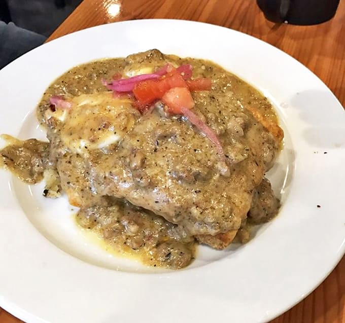 When the yolk breaks and mingles with that velvety sausage gravy, you'll understand why locals set weekend alarms just to secure a table here.