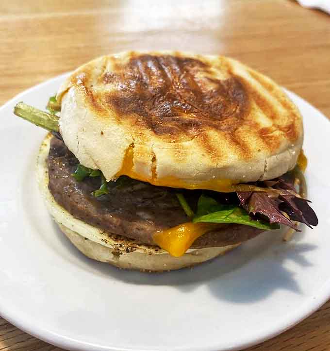 This isn't just breakfast between bread &ndash; it's morning poetry with melted cheddar and perfectly cooked egg.