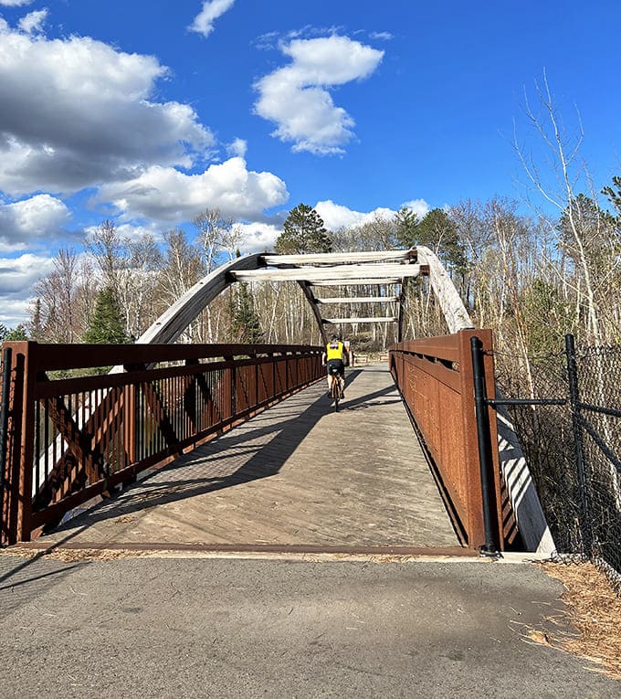 This isn't just a bridge—it's a portal between worlds, inviting cyclists to cross over while wondering what magnificent views await on the other side.