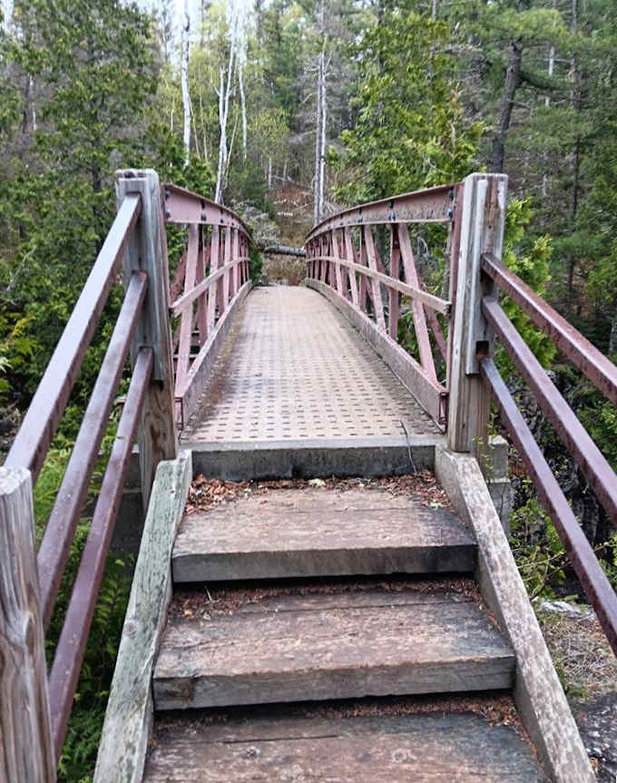This charming footbridge crosses the Caribou River, offering your first teasing glimpse of what awaits downstream.