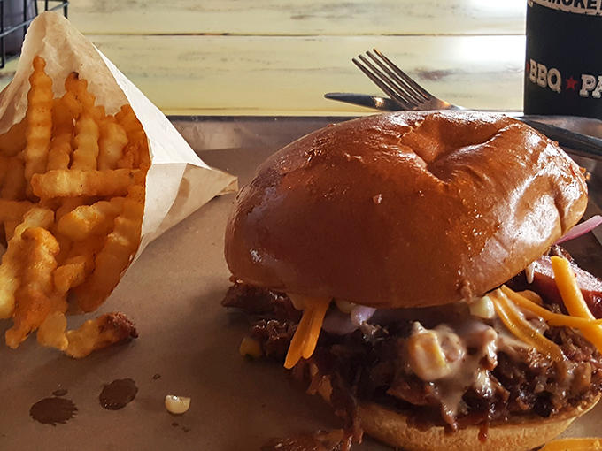The brisket burger arrives with crispy, golden crinkle-cut fries &ndash; a dynamic duo that makes fast food chains weep with inadequacy.