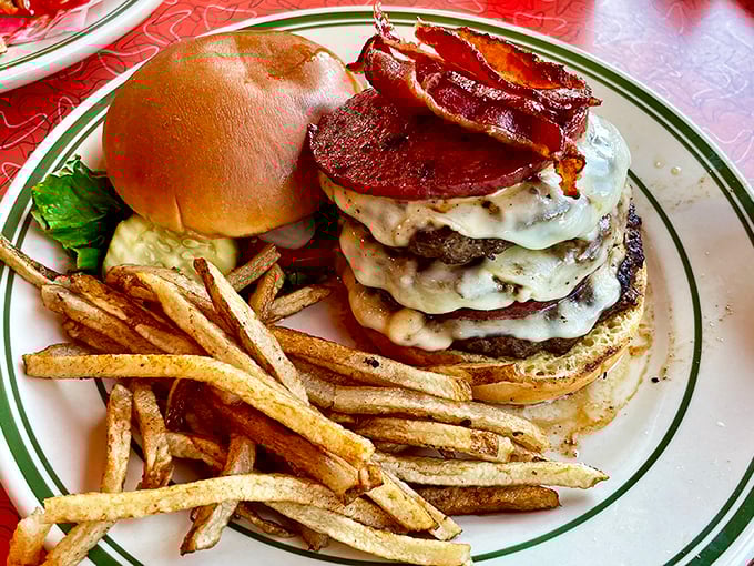 This isn't just a burger &ndash; it's a towering monument to American appetite, with multiple patties, cheese, and bacon creating a delicious architectural marvel.