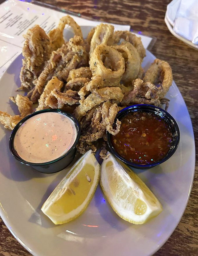 Golden-fried calamari with two dipping sauces – crispy, tender, and destined to disappear before anyone admits they've had enough.