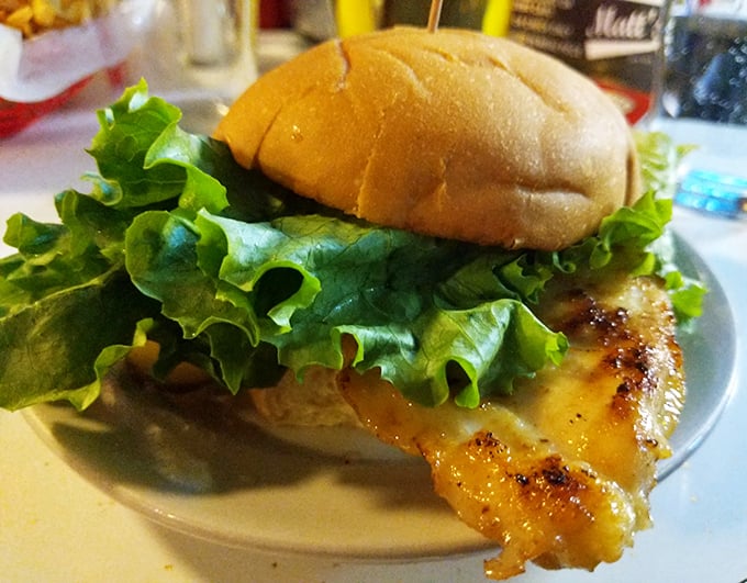 A fresh-off-the-grill burger with crisp lettuce shows the care that goes into each simple but perfect creation.