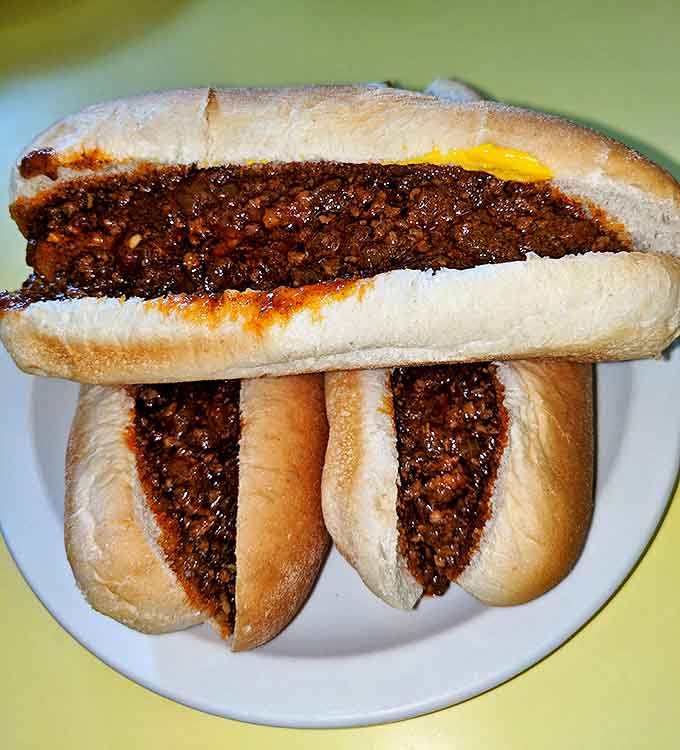 Chili dogs that demand respect and at least three napkins – a messy masterpiece worth every delicious bite.