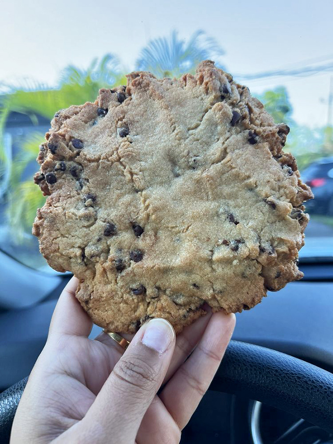 This chocolate chip cookie isn't just dessert – it's therapy in edible form, with a diameter that rivals small dinner plates.