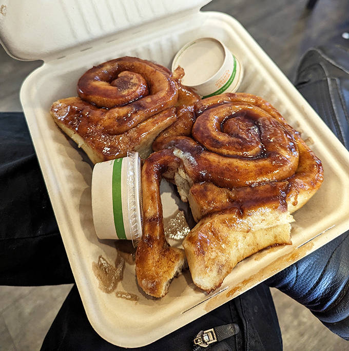 Twin cinnamon spirals nestled in their takeout container &ndash; proof that sometimes the best souvenirs from Minnesota aren't postcards but pastries.