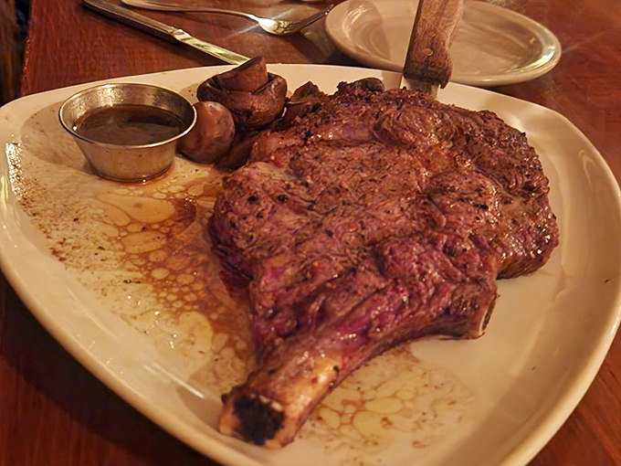 The bone-in ribeye arrives like a prehistoric challenge, but one bite of that perfectly marbled beef will turn you into a devoted carnivore.