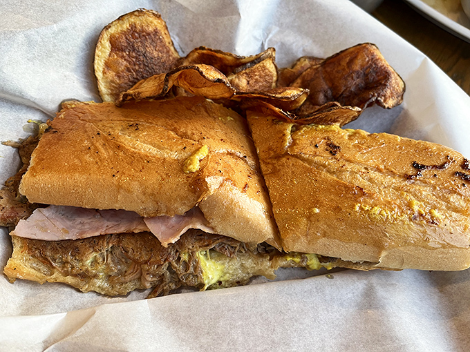 A marriage made in culinary paradise &ndash; crispy, pressed sandwich meets homemade chips for the ultimate comfort food experience.