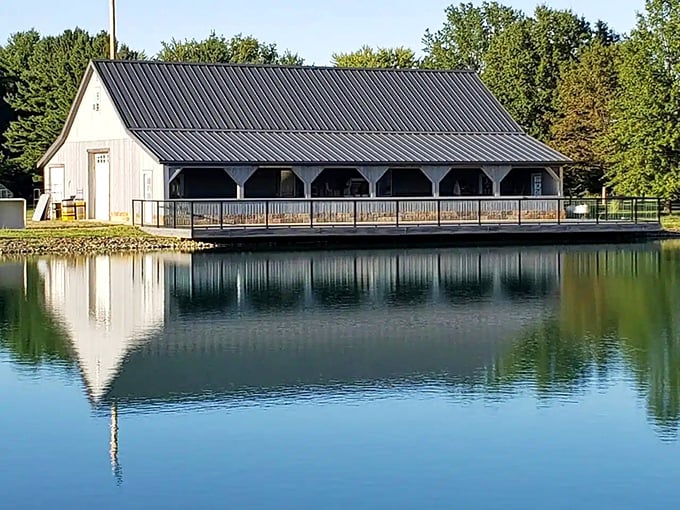 Das Weinhaus reflects perfectly in the still pond waters, creating a double image of serenity that makes photographers reach for their cameras.