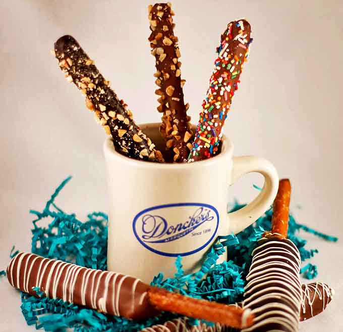 Chocolate-covered pretzels dressed in their finest toppings, proving that salty and sweet together is still the greatest love story ever told.