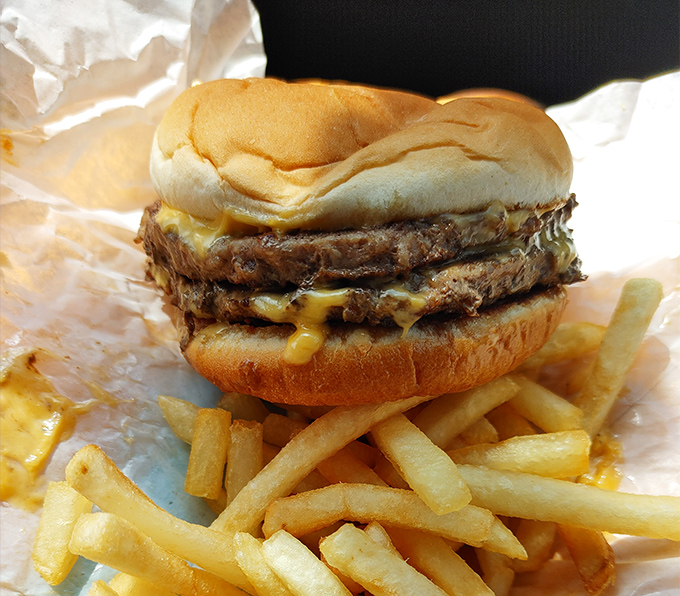 Lou's double cheeseburger doesn't need fancy toppings or artisanal buns – it lets the beef, cheese, and grill marks do all the talking.