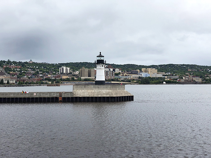 The North Pier Light stands guard at the harbor entrance, a stalwart maritime sentinel that's seen a century of storms.