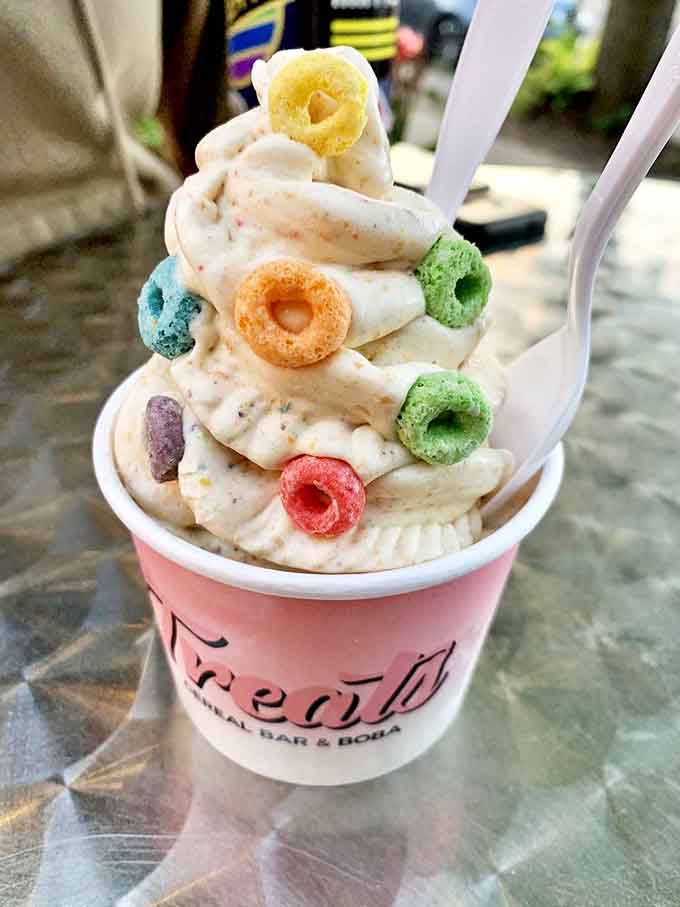 A rainbow mountain of soft serve dotted with Fruit Loops&mdash;proof that sometimes playing with your food is exactly what the doctor ordered.