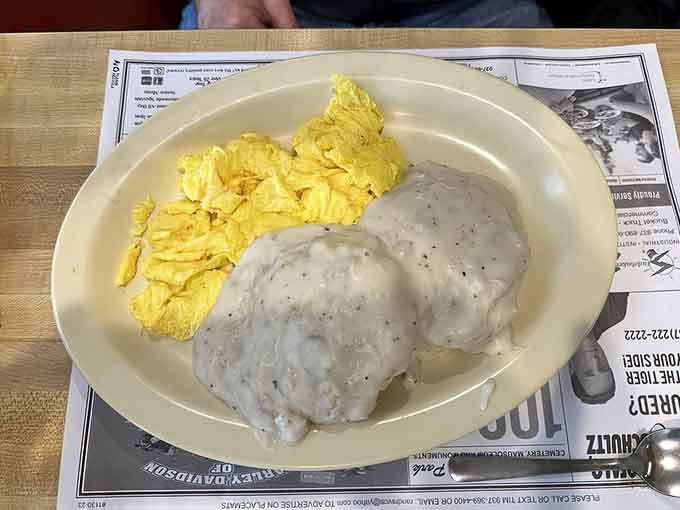 Fluffy biscuits meet creamy gravy and perfectly scrambled eggs in this breakfast trinity that makes mornings worth experiencing.