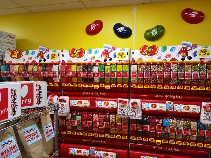 The Jelly Belly wall stands like a colorful pharmacy dispensing prescribed doses of happiness &ndash; each flavor promising its own unique sugar rush.