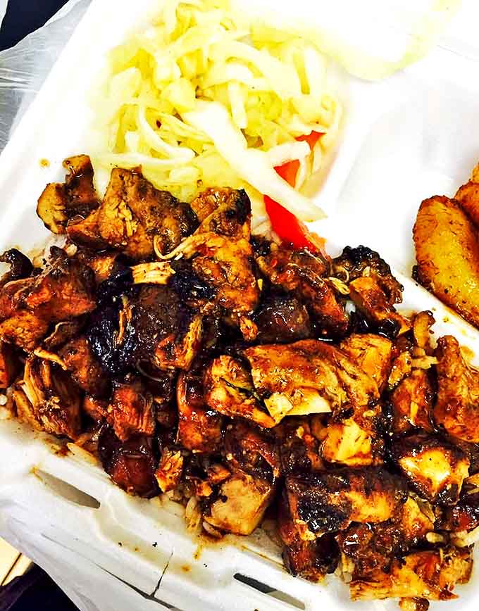 Jerk chicken that makes your taste buds do the reggae &ndash; tender chunks of spice-infused meat alongside cooling cabbage slaw and sweet plantains.