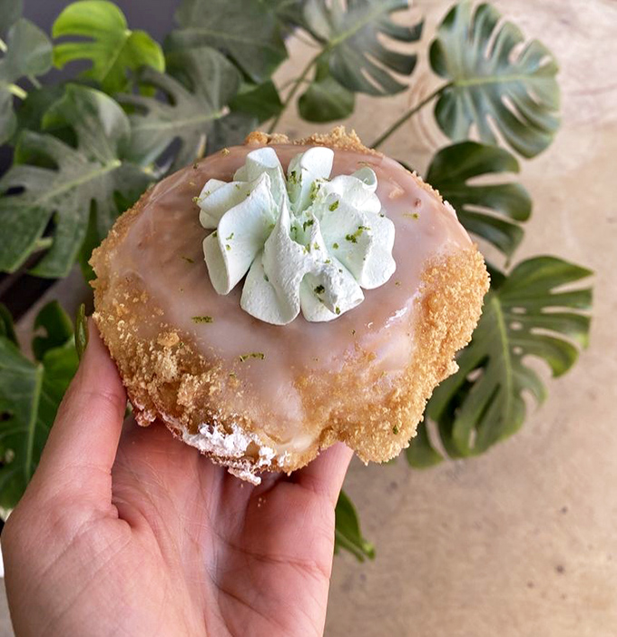 This Key Lime Pie doughnut isn't just dessert, it's Florida sunshine transformed into handheld happiness with a meringue cloud on top.