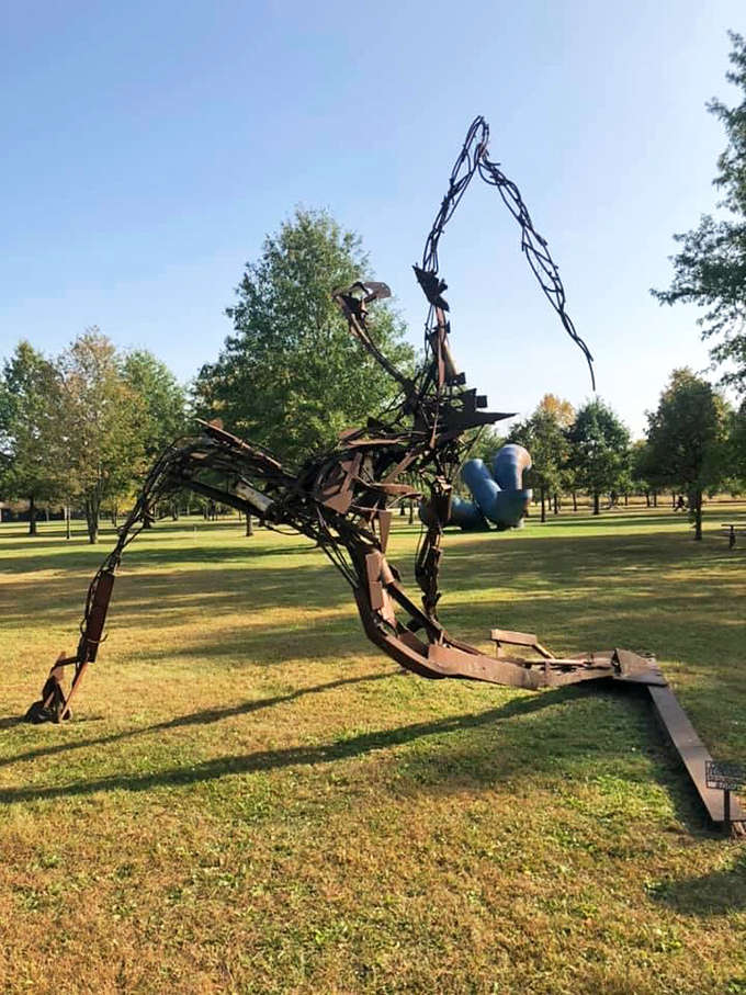 This rusted metal sculpture emerges from the landscape like some ancient creature awakening after centuries of slumber.