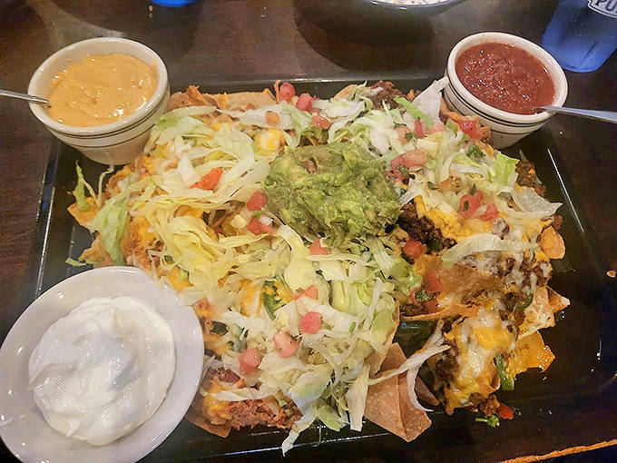 These loaded nachos aren't just a snack, they're an event &ndash; a mountain of melty cheese, fresh toppings, and three dipping sauces.