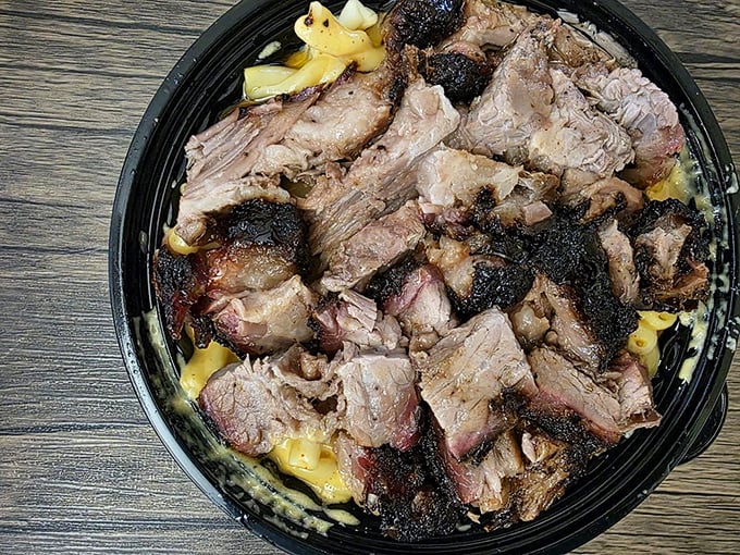 Mac and cheese crowned with brisket represents the kind of culinary genius that makes you question every other meal you've ever considered satisfying.