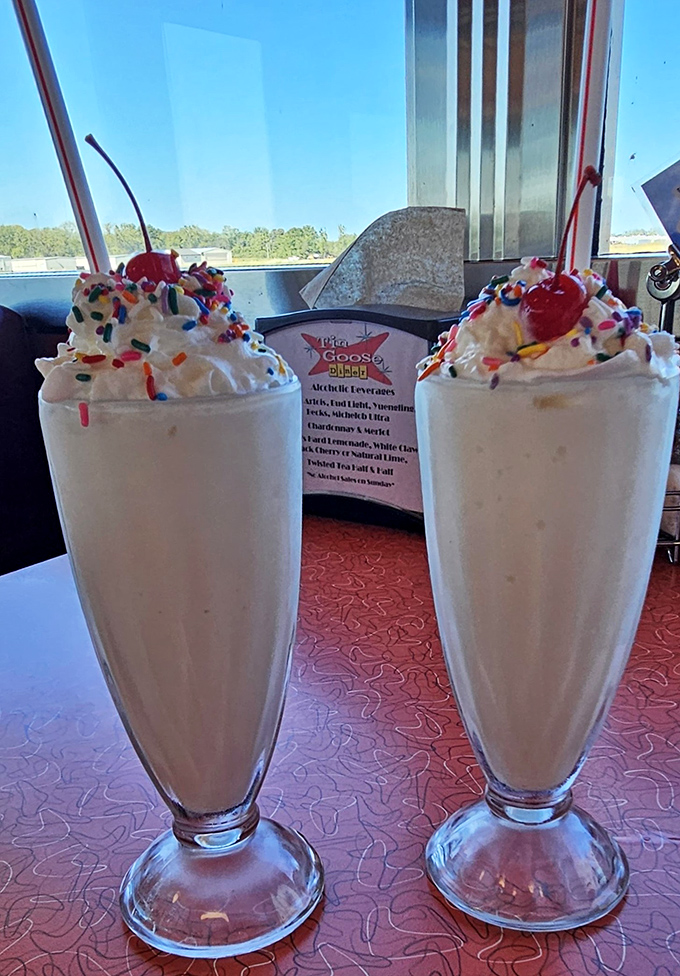 Childhood dreams come true in milkshake form – colorful sprinkles and cherries crown these frosty masterpieces that taste even better than they look.