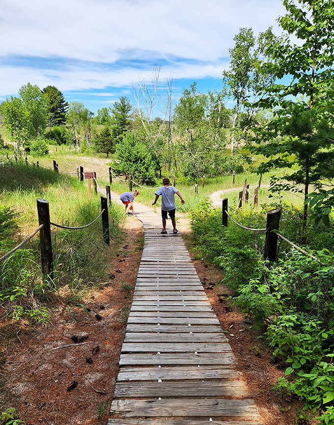 Two explorers venture forth on nature's highway &ndash; a wooden path cutting through Wisconsin's wild heart.