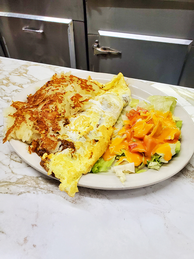 Breakfast knows no time constraints at Duly's &ndash; this cheese-laden omelet with crispy hash browns proves morning glory happens around the clock.