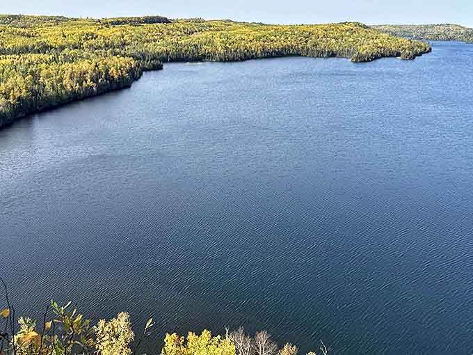 The lake stretches to the horizon like nature's infinity pool, making you wonder why anyone bothers with artificial swimming spots.