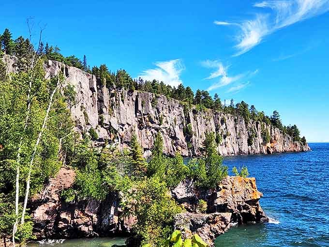 Nature's skyscraper: Palisade Head rises dramatically from Lake Superior, offering vertigo-inducing views that make your smartphone camera seem woefully inadequate.