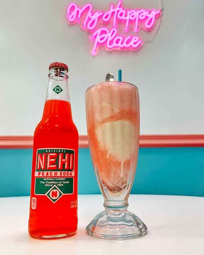 Nehi Peach meets creamy shake under a neon declaration of happiness &ndash; a pairing that makes taste buds time travel.