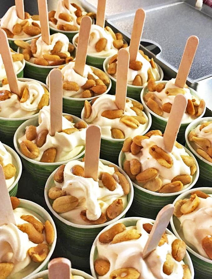 Peanut sundaes lined up like soldiers &ndash; that perfect marriage of creamy vanilla and salty nuts creates a symphony in each spoonful.