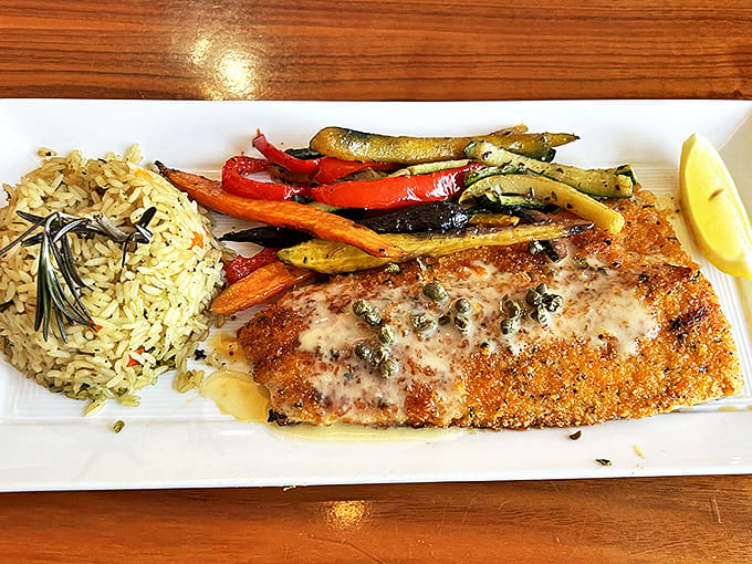 Pan-seared sea bass with lemon caper sauce &ndash; proof that island dining can be both sophisticated and satisfying.